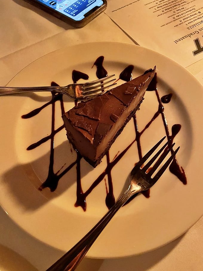 A slice of chocolate cake drizzled with sauce that's clearly been designed to make you forget all about that diet you were considering.