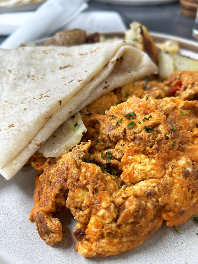 A Spanish tortilla that would make abuelitas nod in approval, served with sausage and greens for the perfect balance.