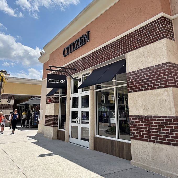 The Citizen store stands sentinel with its brick accents and navy awning&mdash;timeless design for a store that literally sells time.