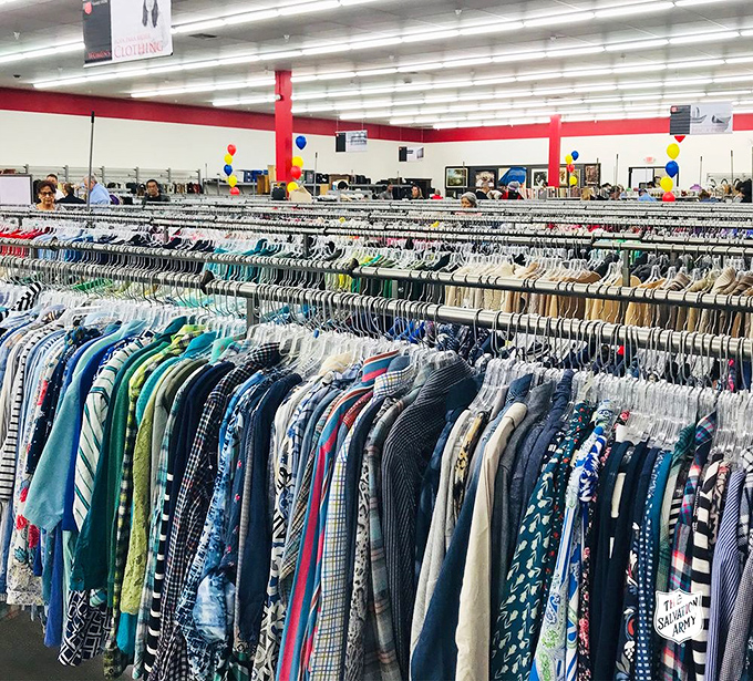 The men's section stretches to infinity, a sea of patterns and possibilities where yesterday's fashion becomes tomorrow's vintage statement.