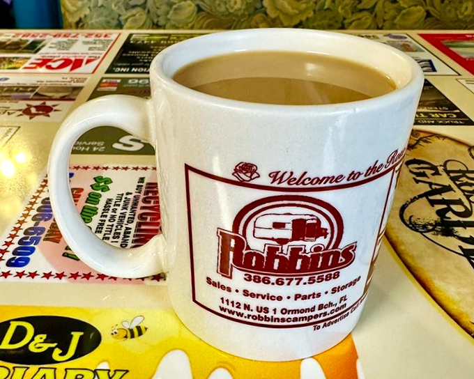The coffee mug says "Welcome" but what it really means is "Stay awhile and solve the world's problems over unlimited refills."