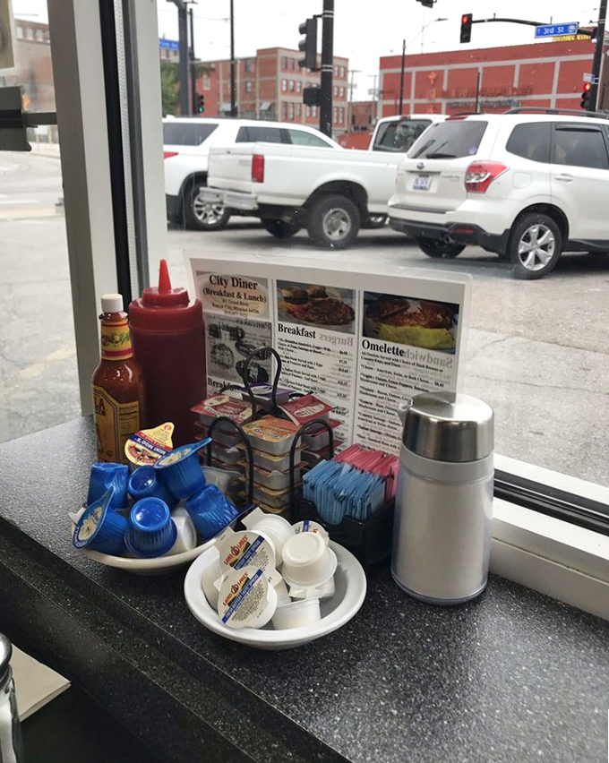 The condiment corner—where ketchup, hot sauce, and sugar packets patiently wait to elevate your meal from delicious to transcendent.