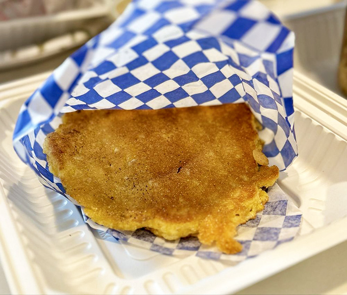 Cornbread so perfect it deserves its own sonnet – golden, slightly sweet, with edges that crisp just right. The ideal companion for sopping up every last bit of sauce.