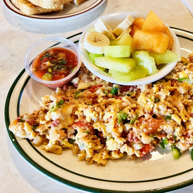 A colorful scramble that brings together eggs, fresh fruit, and enough protein to fuel your entire day. Breakfast of champions, indeed.