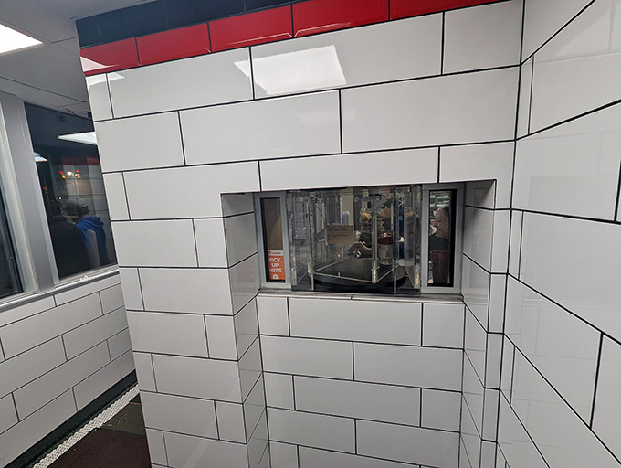 The white-tiled service window offers a glimpse into burger alchemy, where simple ingredients transform into Detroit's most beloved sliders.