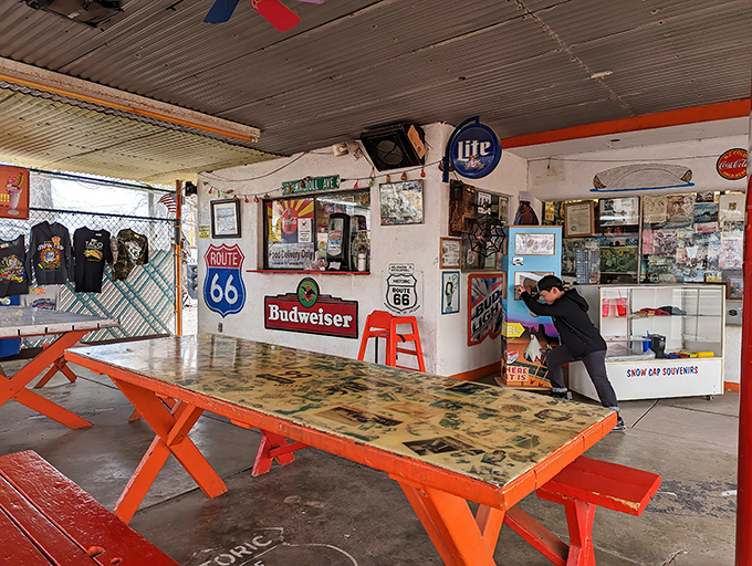 The covered patio's orange picnic tables have hosted more road trip stories than a bestselling travel memoir. Pull up a bench and add yours.