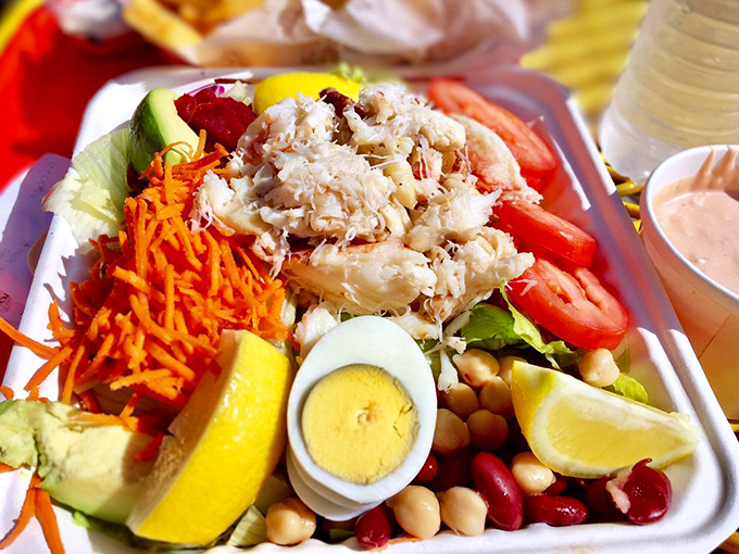 The Crab Louie arrives dressed to the nines, a salad that thinks it's attending a garden party.