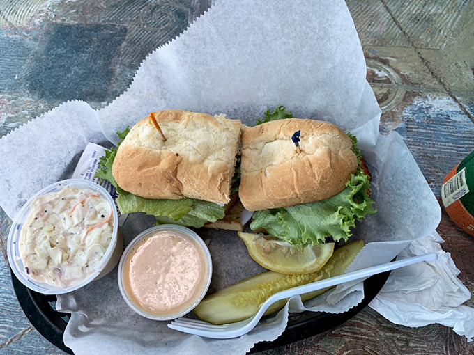 A proper po'boy should require both hands and several napkins. This crab cake version checks all the boxes while adding a Florida twist.