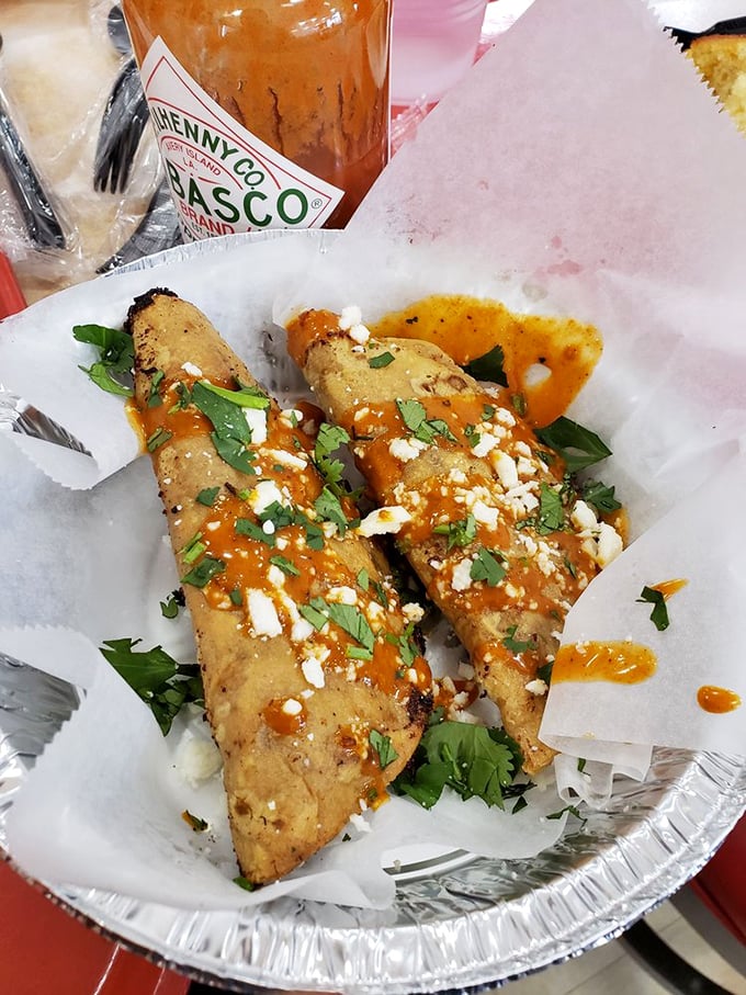 These aren't just tacos&mdash;they're crispy vessels of joy, topped with hot sauce, cilantro, and cheese that make your taste buds throw a spontaneous fiesta.