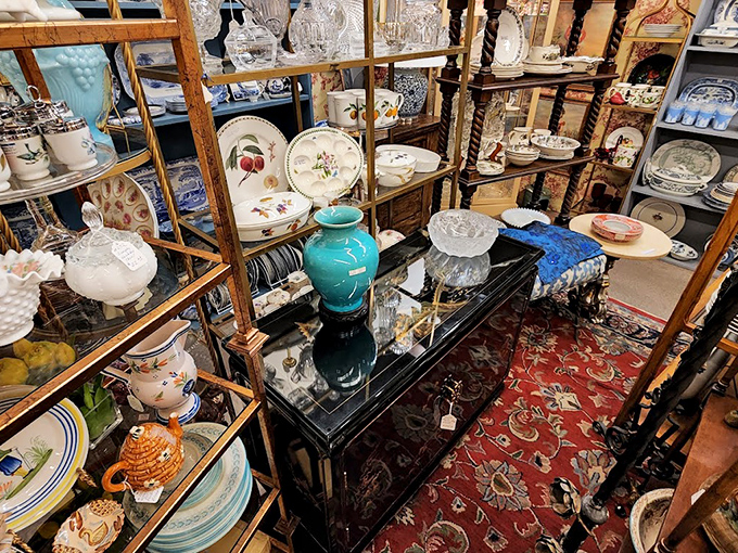 Crystal, china, and ceramics stacked with the precision of a Jenga tower. One person's downsizing becomes another's dining room showpiece.