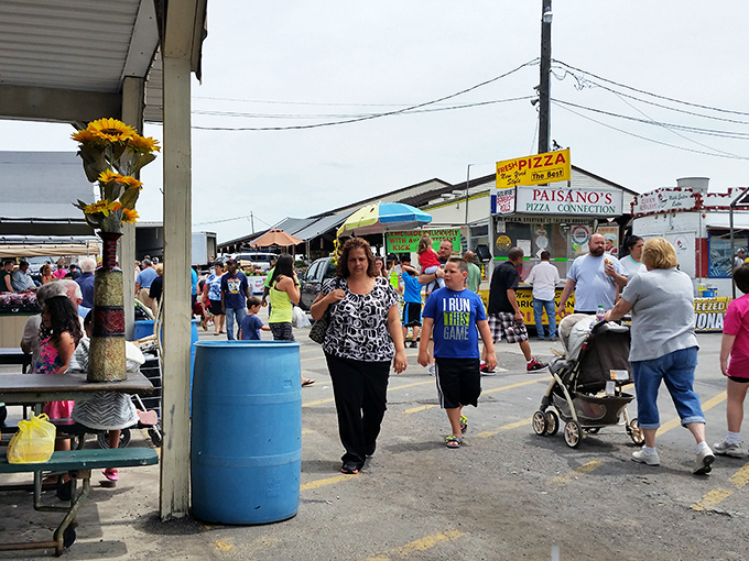 The outdoor market buzzes with weekend warriors on the hunt for deals, with Paisano's Pizza standing by for when bargain-hunting hunger strikes.