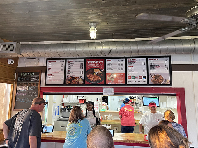 The ordering counter where seafood dreams come true. Notice the lack of fancy digital displays&mdash;just good people ready to feed you well.