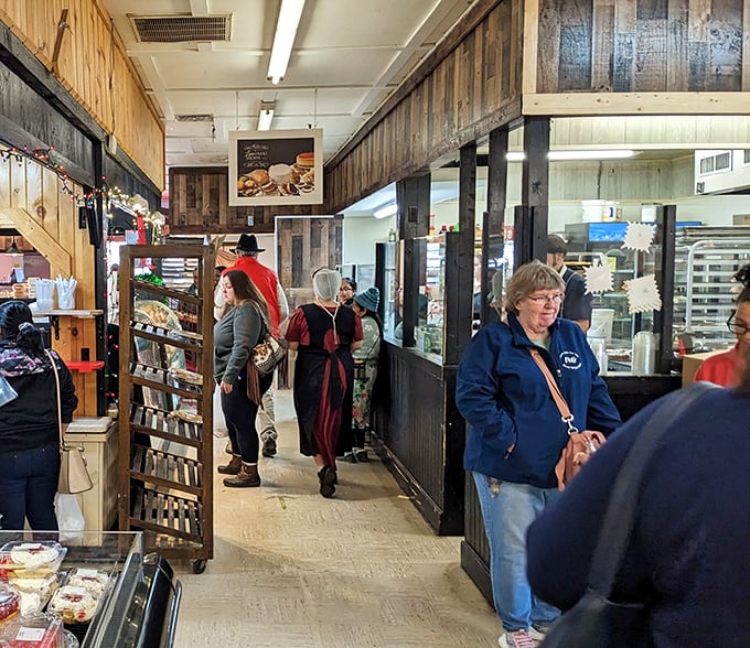The narrow walkways of the indoor market create a perfect environment for chance encounters with both treasures and friendly faces.