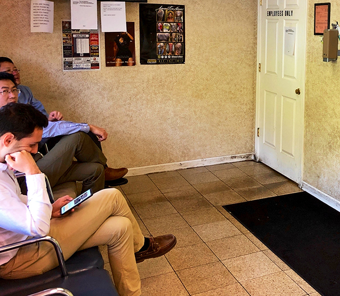 The waiting area – where strangers become comrades united by the universal language of anticipation and the aroma of smoked meats.