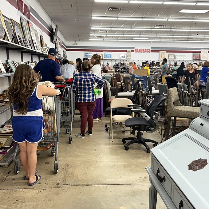 The weekend warriors of thrifting navigate the furniture maze with practiced eyes. Veterans know: hesitate on that vintage chair, and someone else claims the prize. 