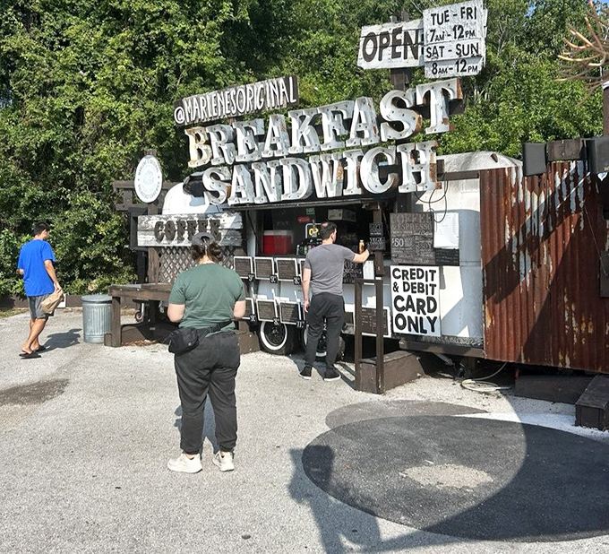 The breakfast pilgrimage in action - customers making the wise morning choice to join the sandwich faithful at this Tampa treasure.