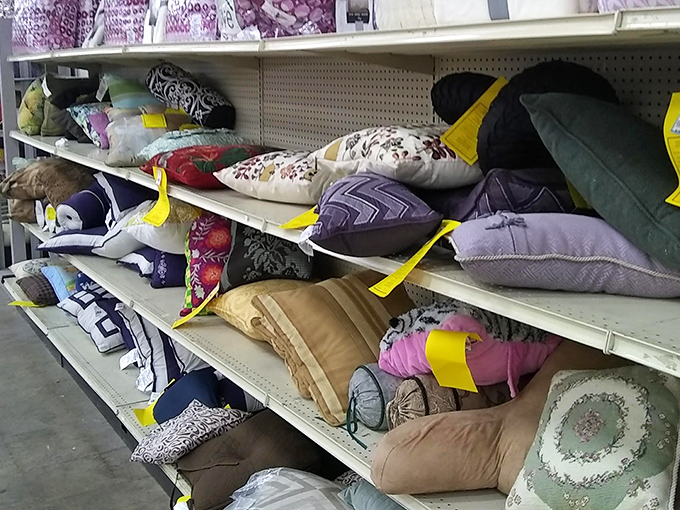Decorative pillow mountain&mdash;each one previously purchased with great enthusiasm, briefly displayed, then donated in Marie Kondo-inspired clarity.