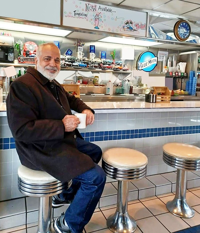 The counter seating offers front-row tickets to the culinary show. Coffee tastes better when sipped from a classic diner mug.