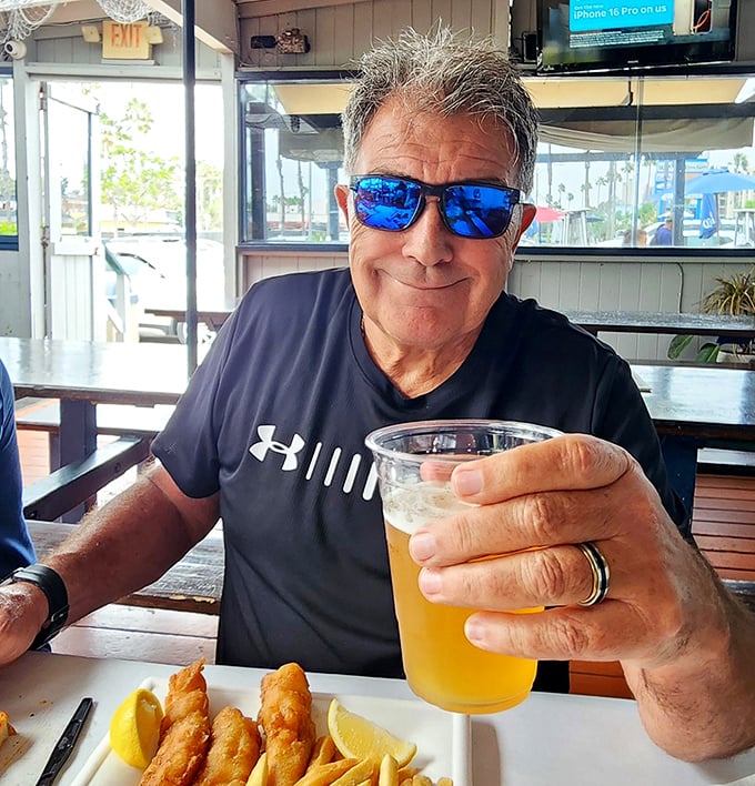Nothing says "I'm having a good day" like fried seafood, cold beer, and that satisfied smile that comes from knowing you've made excellent life choices.