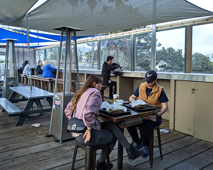 The covered dining area offers respite from the California sun while keeping you close enough to hear the ocean's soundtrack.