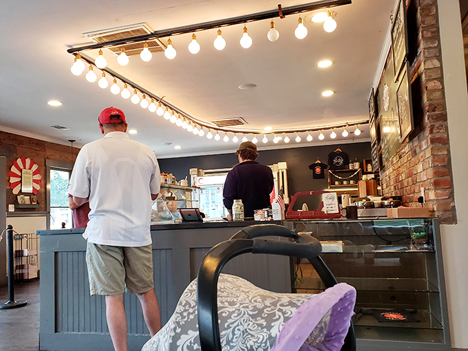 The string lights overhead cast a warm glow as customers patiently wait for their moment of frozen euphoria.