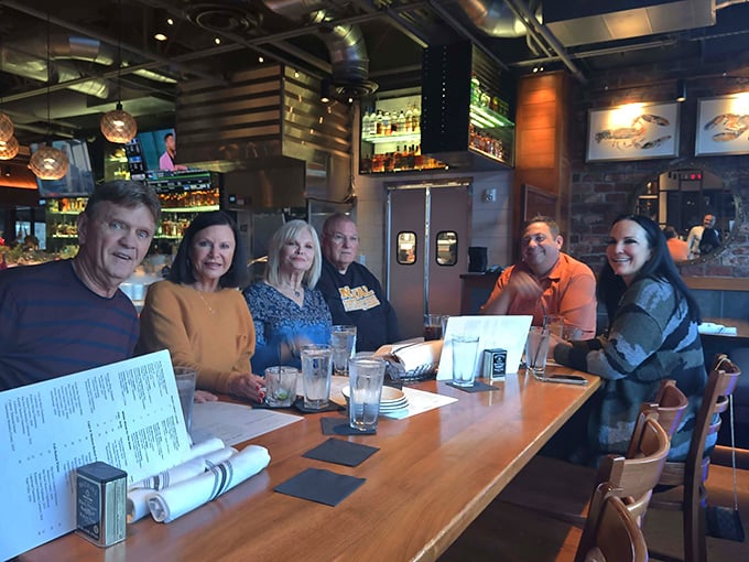 The true measure of a great restaurant: tables filled with happy diners sharing stories over seafood that deserves its own conversation.