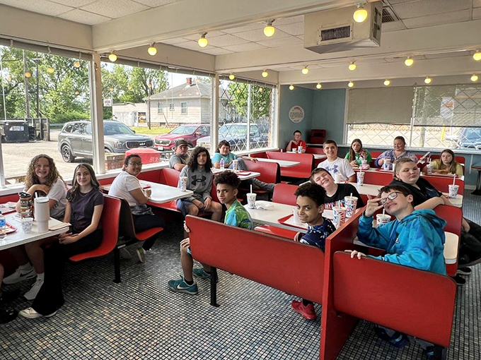 The red booths have witnessed countless first dates, family celebrations, and "just because" Tuesday lunches. Every seat tells a story.