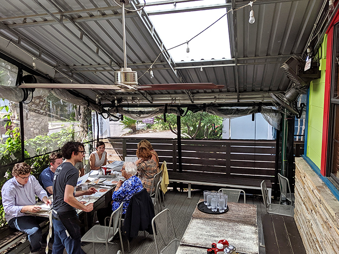 The covered patio – where strangers become friends and friends become family over plates of food that make conversation temporarily impossible.