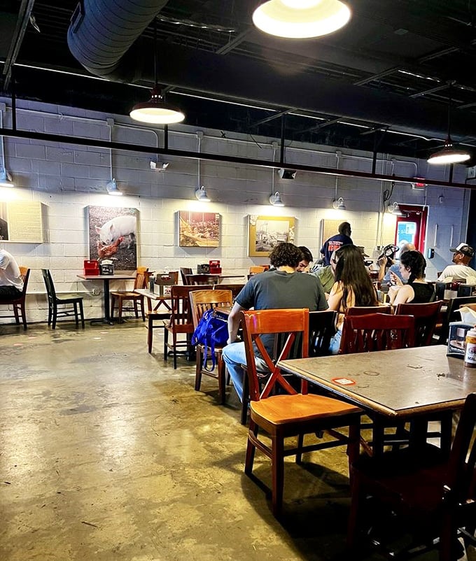 The dining room hums with the universal language of "mmm" as strangers become temporary friends united by the pursuit of perfect barbecue.