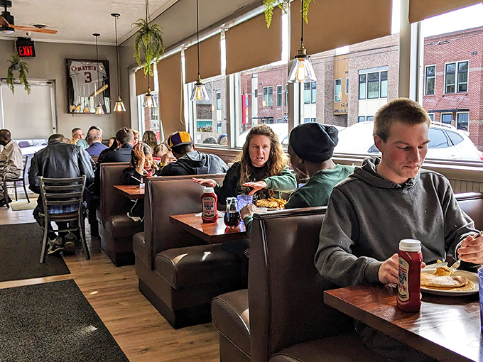 A dining room where strangers become neighbors over plates of pancakes. Notice how nobody's staring at their phones? That's called "living in the moment."