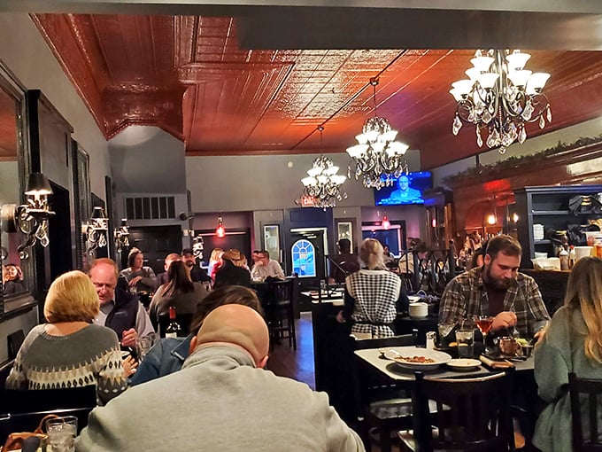 The bustling dining room under that signature red ceiling proves great food creates community, even on a weeknight in small-town Indiana.