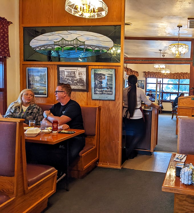 Every great diner has that perfect booth where conversations flow as freely as the coffee, under the watchful gaze of stained glass artwork.