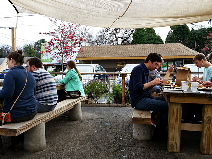 The outdoor seating area: where strangers become friends united by the universal language of "mmm" and "you've got to try this."
