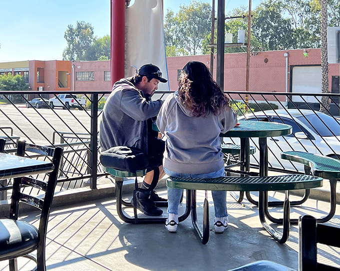 Every great meal creates memories. Two diners share a moment that perfectly captures why food brings us together better than anything else.