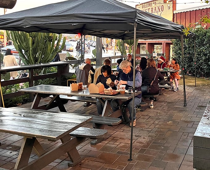 The outdoor dining area: where strangers become friends united by the universal language of "have you tried the brisket yet?"