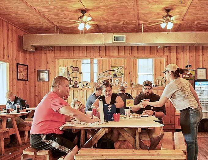 The universal language of barbecue brings strangers together at communal tables, united in the pursuit of smoky perfection.