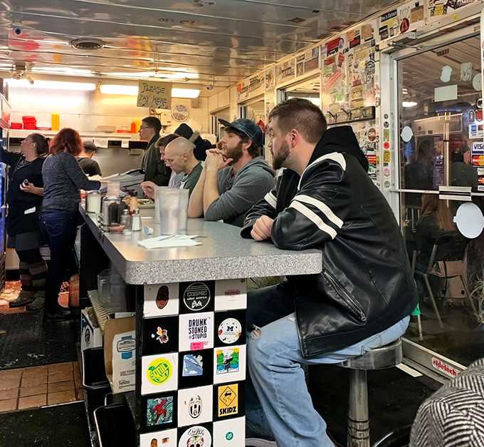 The counter crew&mdash;where strangers become temporary friends over coffee and shared space in this intimate diner universe.