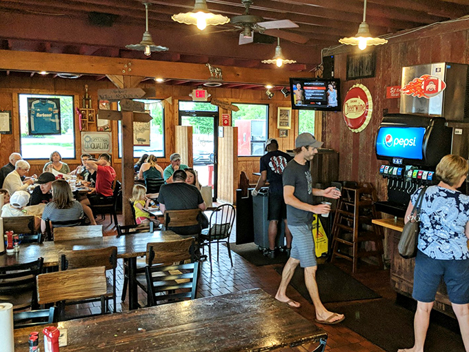 The dining room buzzes with the universal language of satisfied customers. Notice how nobody's talking? They're too busy eating.