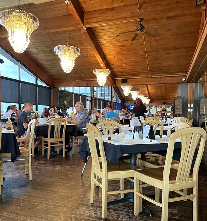 The dining room glows with crystal chandeliers and wood-beamed ceilings—like eating in a rustic Italian villa that somehow landed in Pennsylvania.