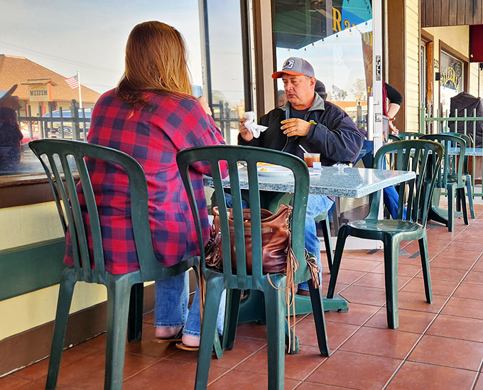 The outdoor patio: where locals exchange town news over coffee. These tables have heard more Ramona stories than any history book.