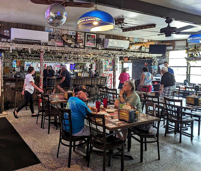Where strangers become friends over fried seafood. The disco ball overhead suggests this place knows how to party after sundown.