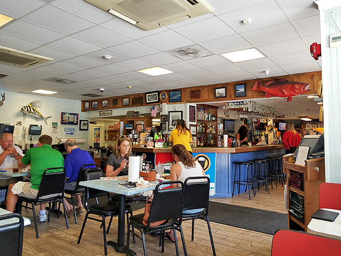 The dining room hums with the universal language of seafood appreciation. Notice the lack of phones &ndash; everyone's too busy using both hands for crab-cracking.