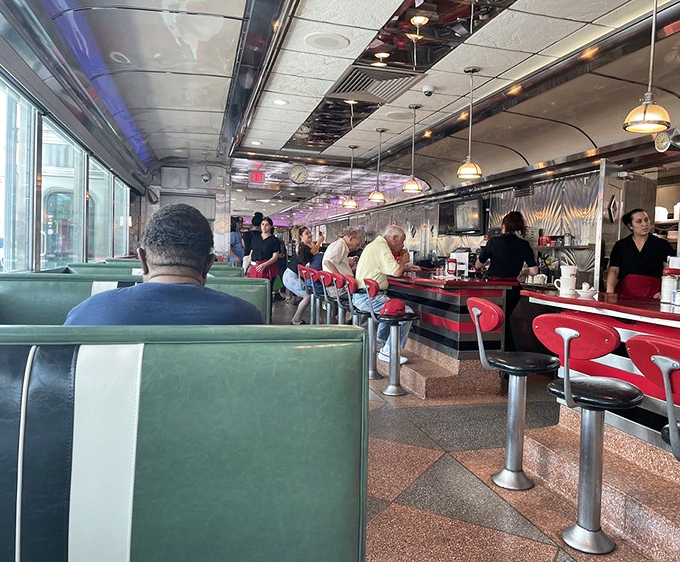 The counter seats&mdash;where solo diners become regulars and servers remember your order before you've fully settled onto your stool.