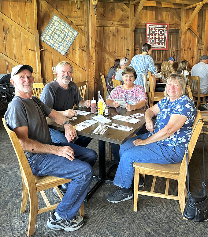 The true measure of a great restaurant: tables filled with happy diners making memories. Notice the quilts &ndash; they're not just decoration, they're conversation starters.