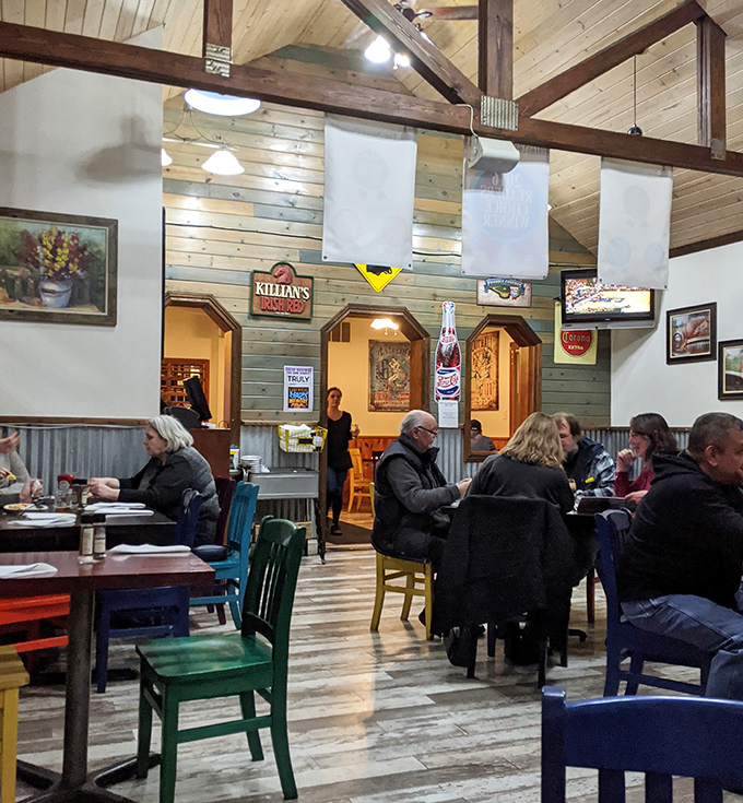 The dining room buzzes with the universal language of satisfied customers, colorful chairs creating an atmosphere as vibrant as the conversation.