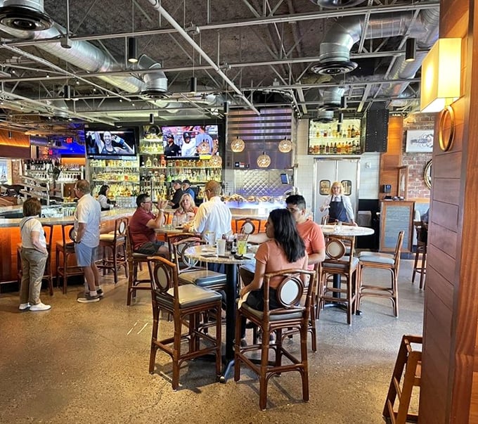 The bar area buzzes with the energy of people making good life decisions. Sports on TV, drinks flowing, and seafood dreams coming true.