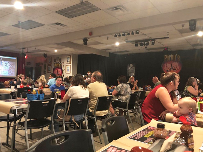 The dining room transforms into a comedy venue at night, where strangers become friends over shared laughter and sauce-stained napkins.
