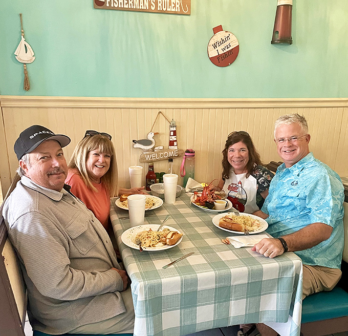 Happy faces around the checkered tablecloth—the universal sign that seafood excellence is happening. These aren't just diners—they're witnesses to culinary magic.