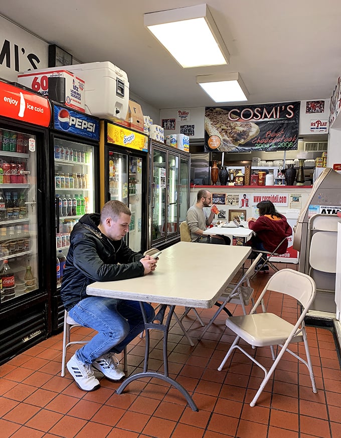 The universal language of sandwich anticipation. Patrons patiently waiting for their orders, knowing that good things come to those who wait for hand-crafted hoagies.