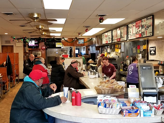 The curved counter isn't just efficient design—it's a community gathering spot where strangers become neighbors over coffee and eggs.